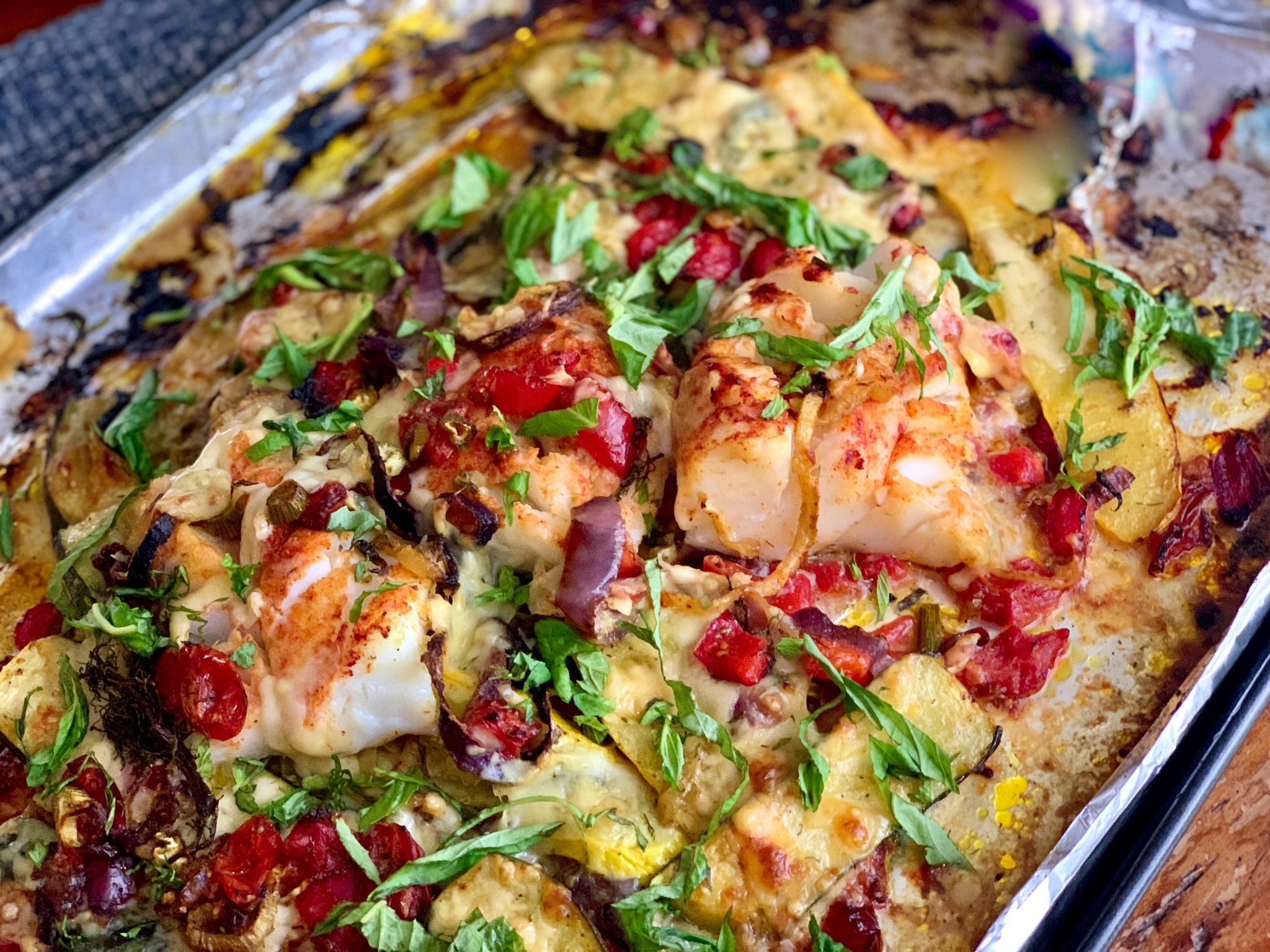 SHEET PAN COD OVER ROASTED VEGGIE PALOOZA - Dish off the Block